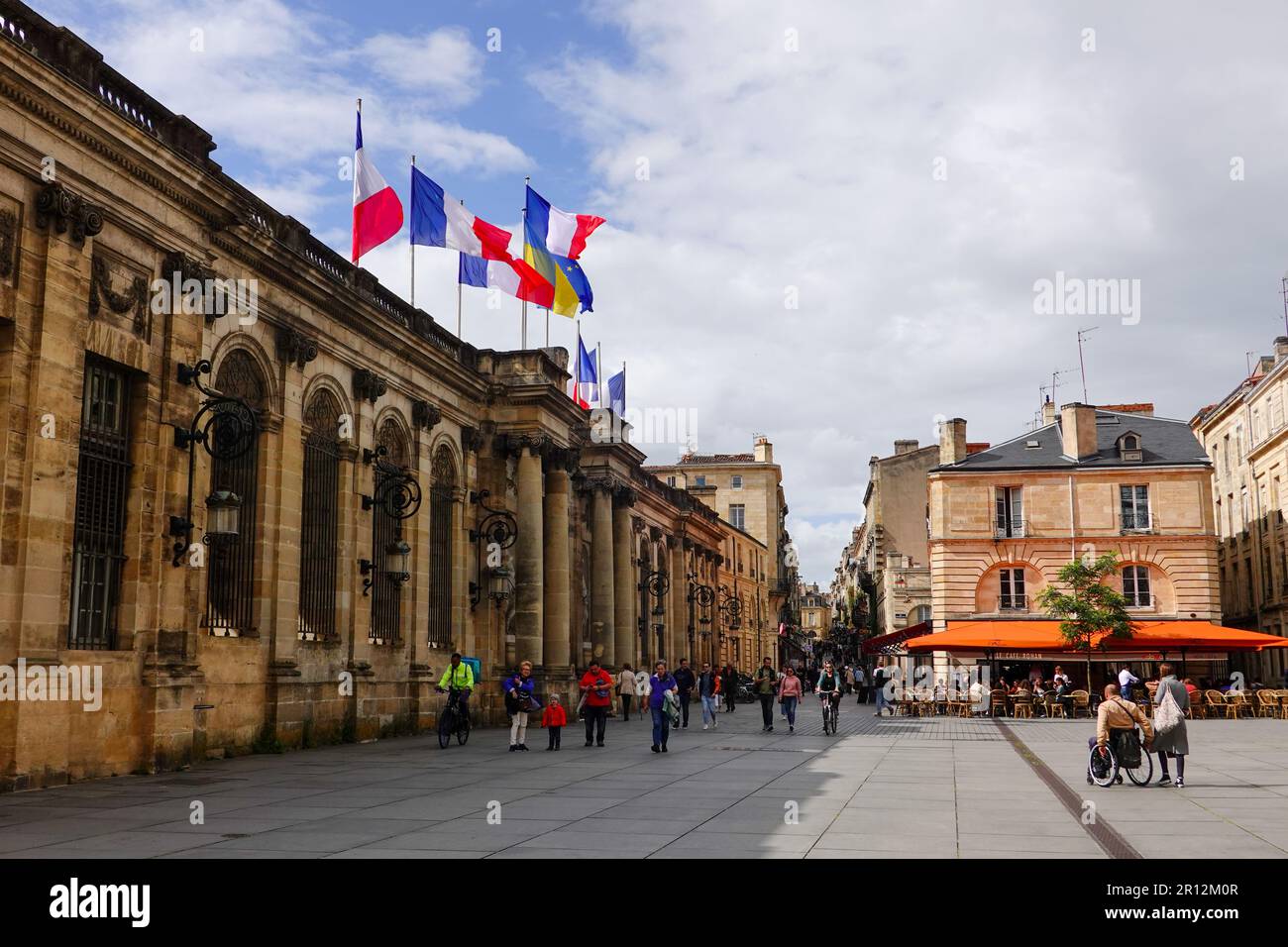 People cycling, in wheelchair, walking, Place Pey Berland, with ...