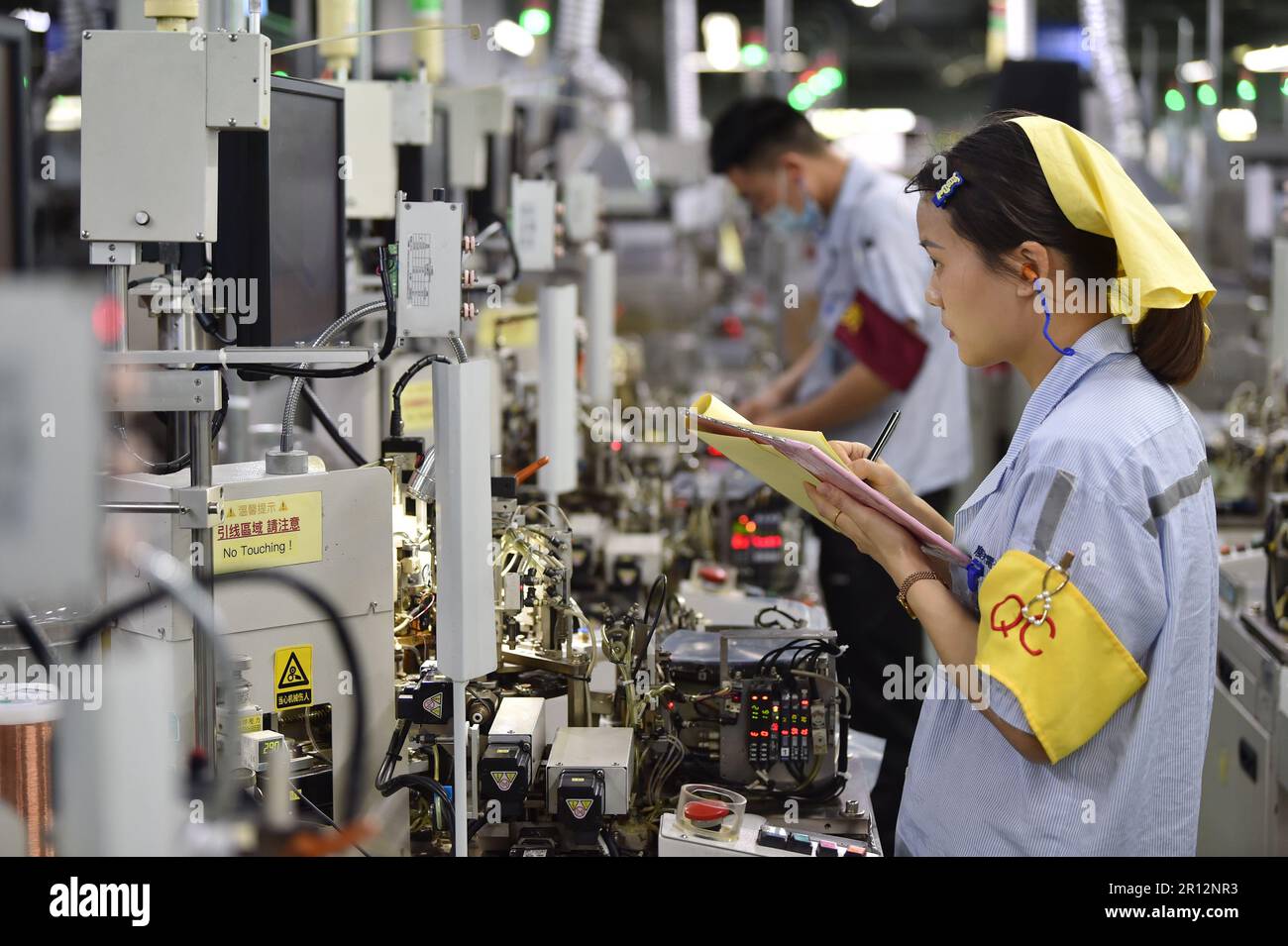 SUQIAN, CHINA - MAY 11, 2023 - Workers produce electronic components on a production line at an ...