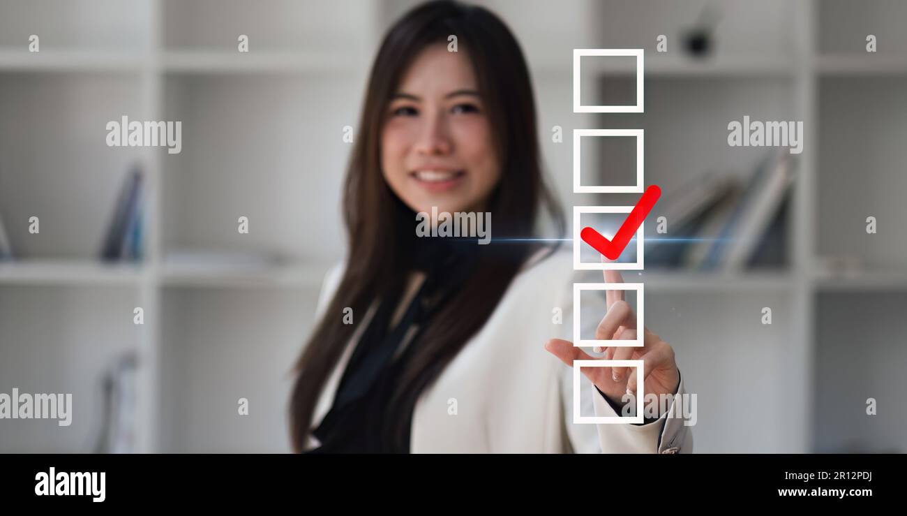 Checklist and Quality Assurance Concept. Businessman marks on check box ...