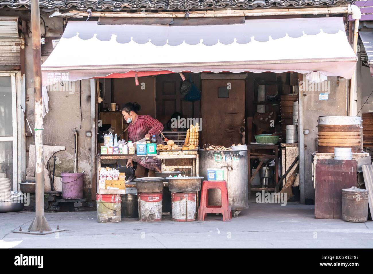 A person displaying and selling a variety of food items from a ...