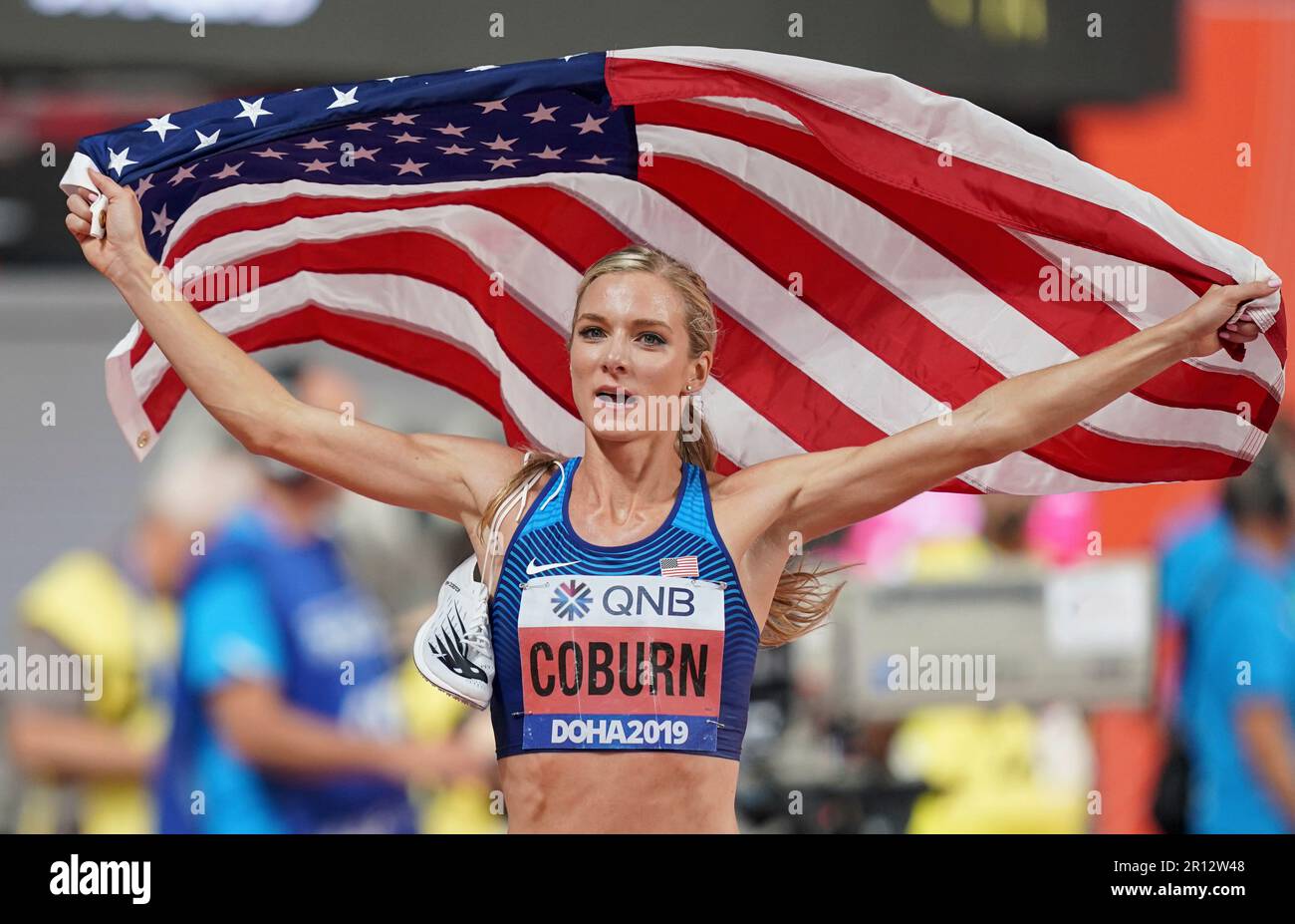 Emma COBURN celebrating his victory with his country's flag in the 3000 ...