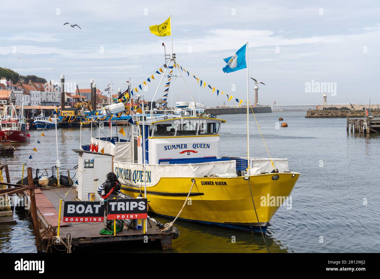 The yellow tourist boat, 'Summer Queen' in the harbour at Whitby, North ...