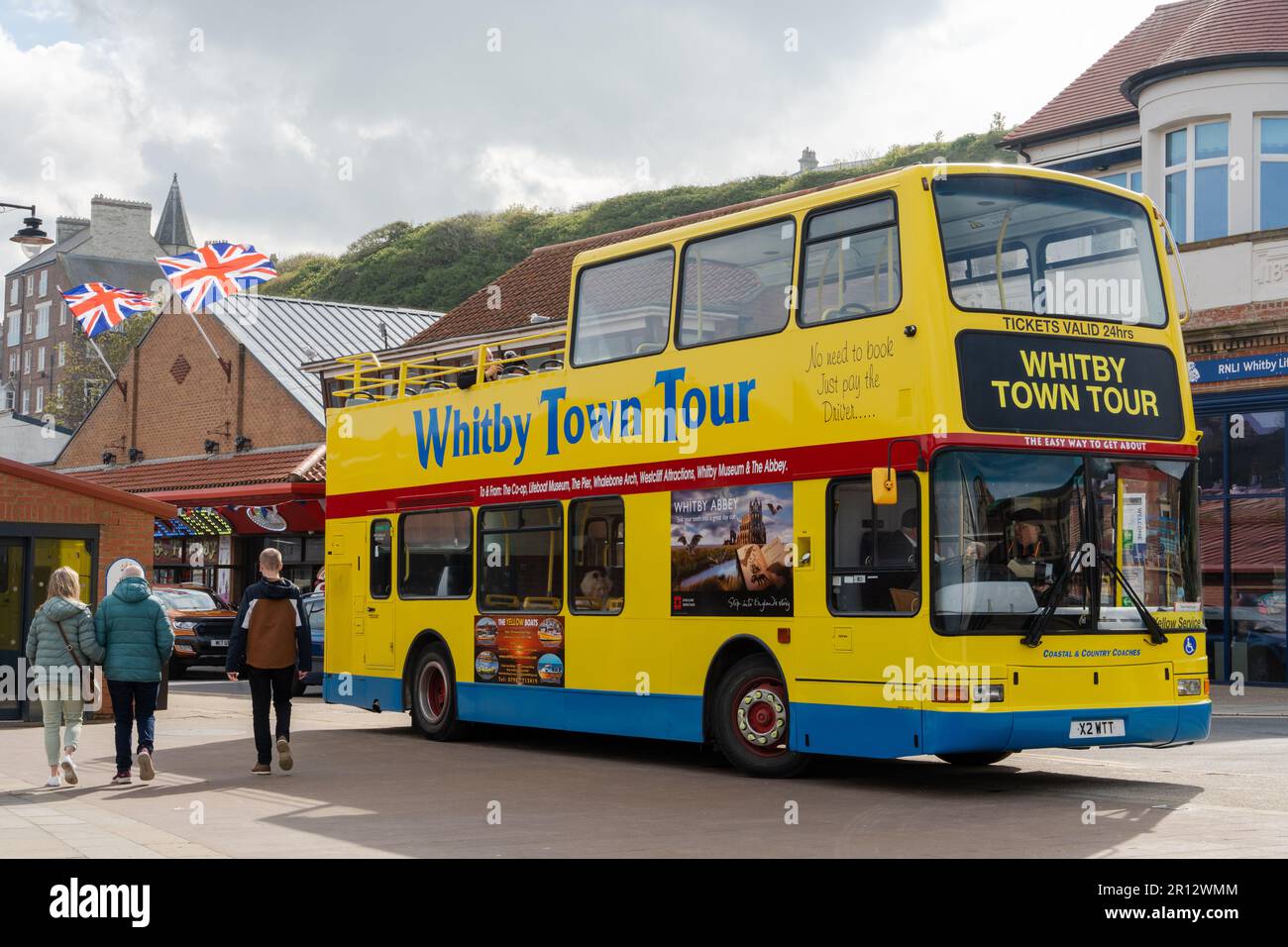 The yellow Whitby Town Tours open top bus, to take visitors around the ...