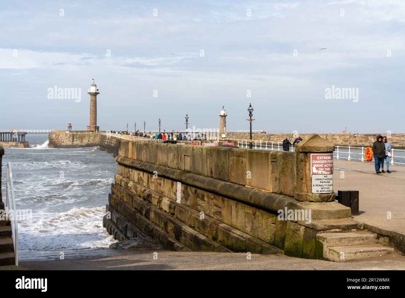 Whitby Pier, popular with tourists visiting the town of Whitby, North ...