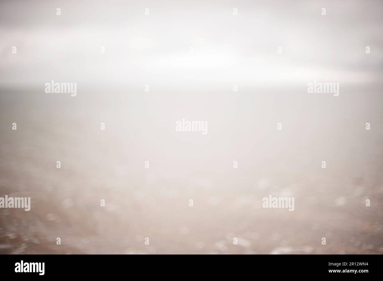 An abstract images of the sea with sun light glinting on the water ...