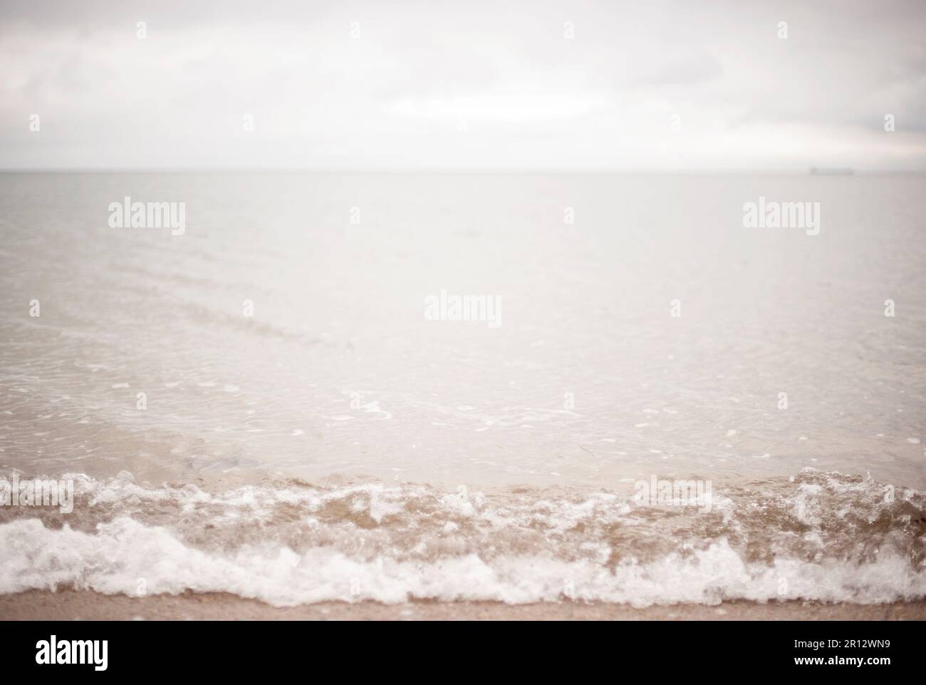 An abstract images of the sea with sun light glinting on the water ...