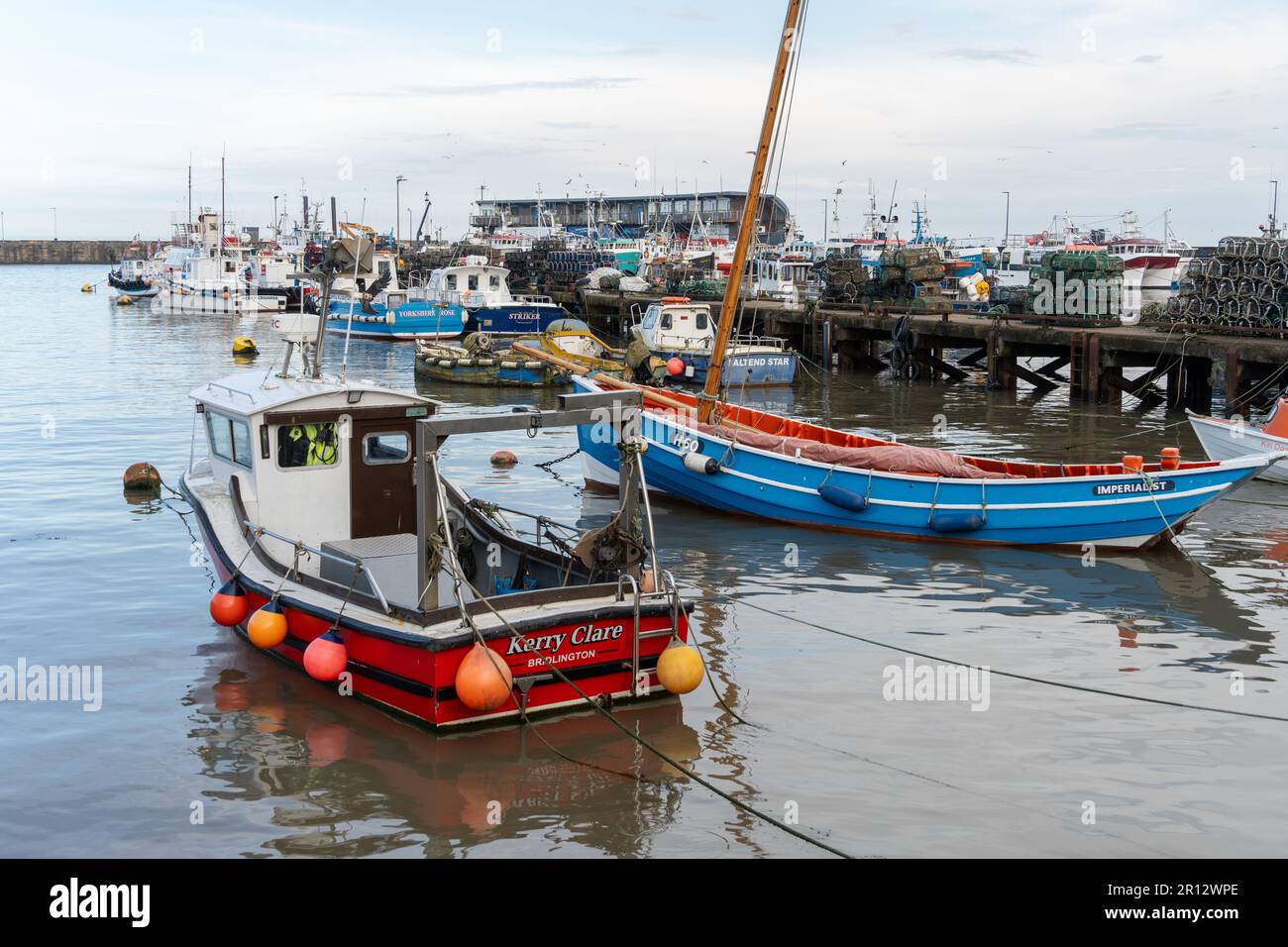 A view of boats in the harbour of the seaside and fishing town of ...