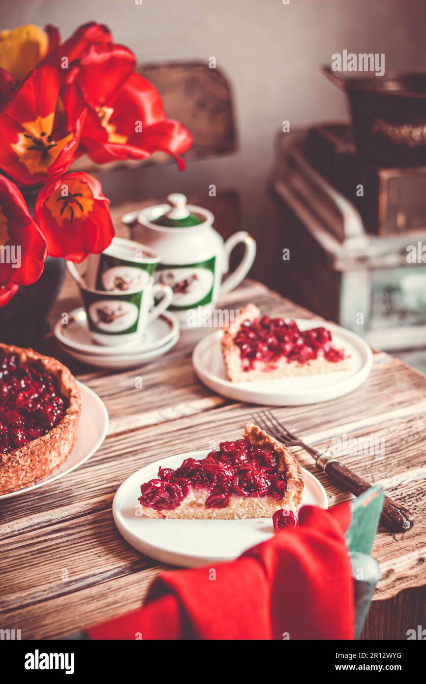 A piece of cherry pie for morning tea. Moody photo Stock Photo - Alamy