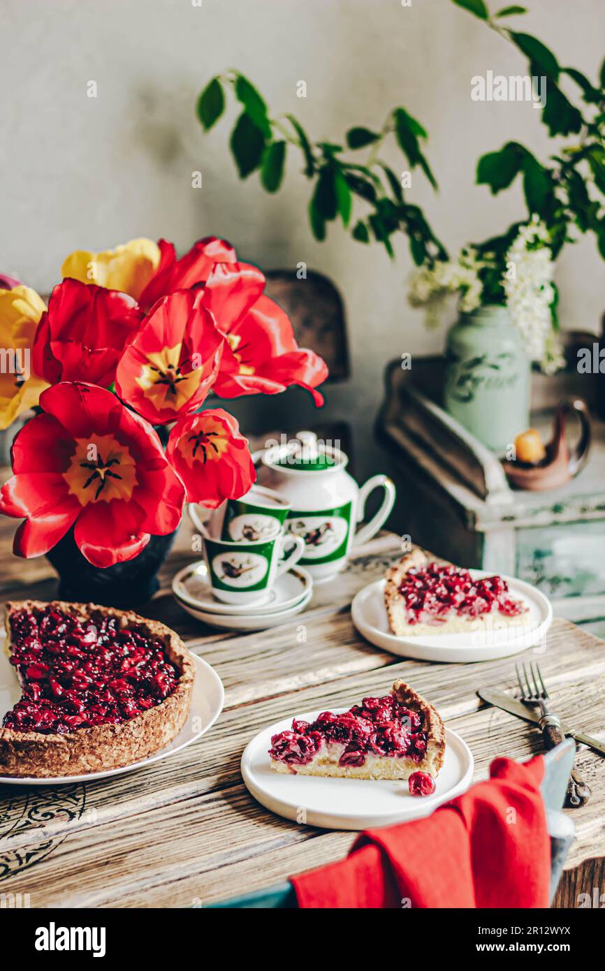 A piece of cherry pie for morning tea. Moody photo Stock Photo - Alamy