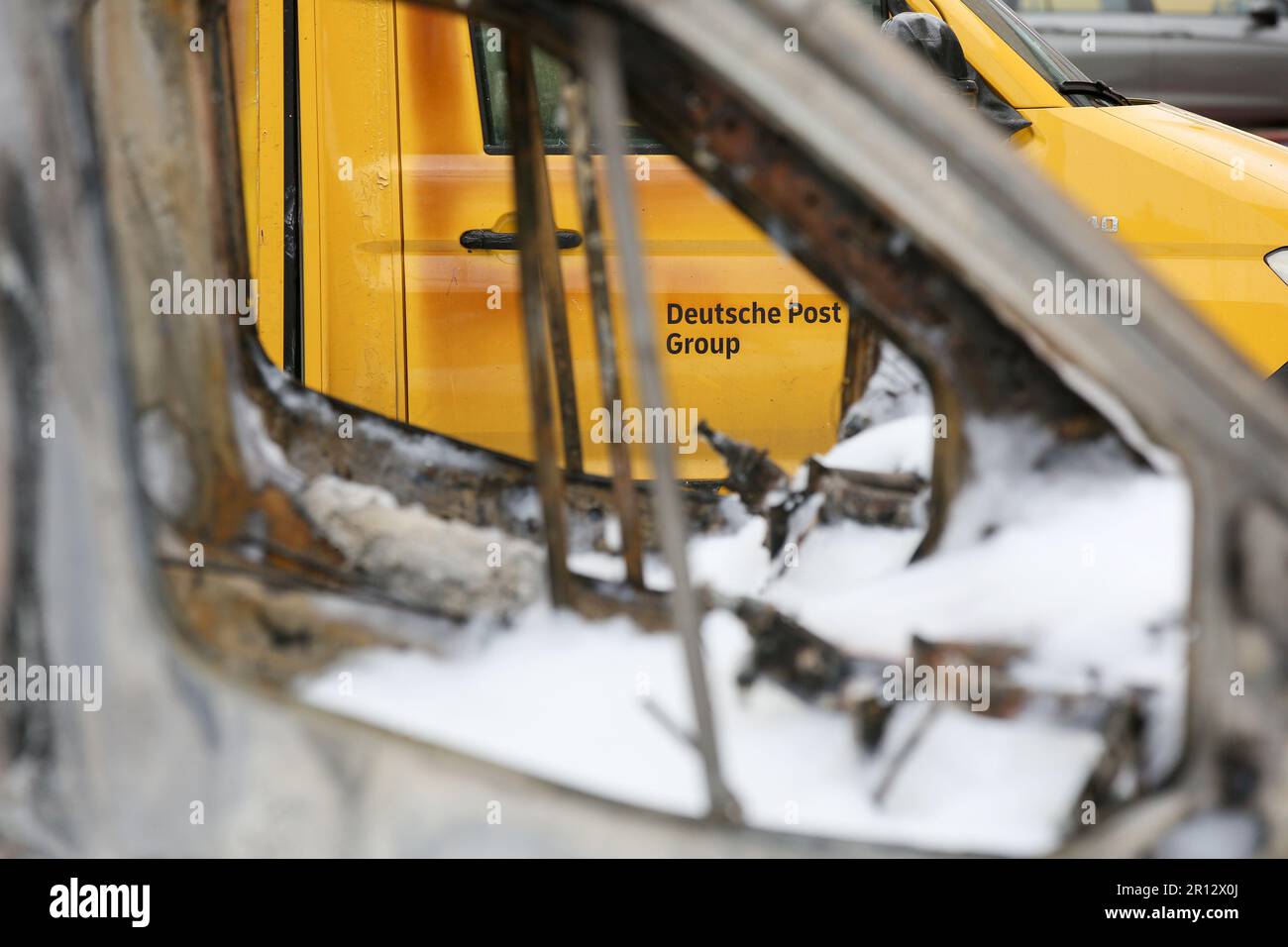 11 May 2023, Hamburg: Several burnt-out delivery vans stand in the ...