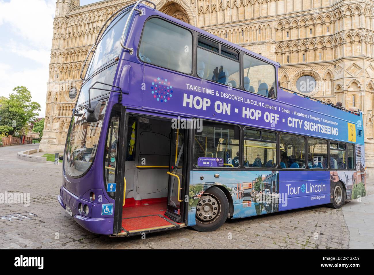 The 'hop on hop off' city tour bus outside Lincoln Cathedral in the ...
