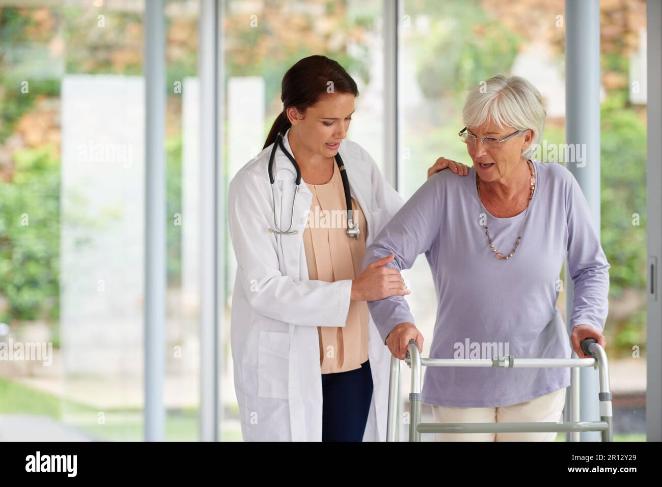Elderly helped walking hi-res stock photography and images - Alamy