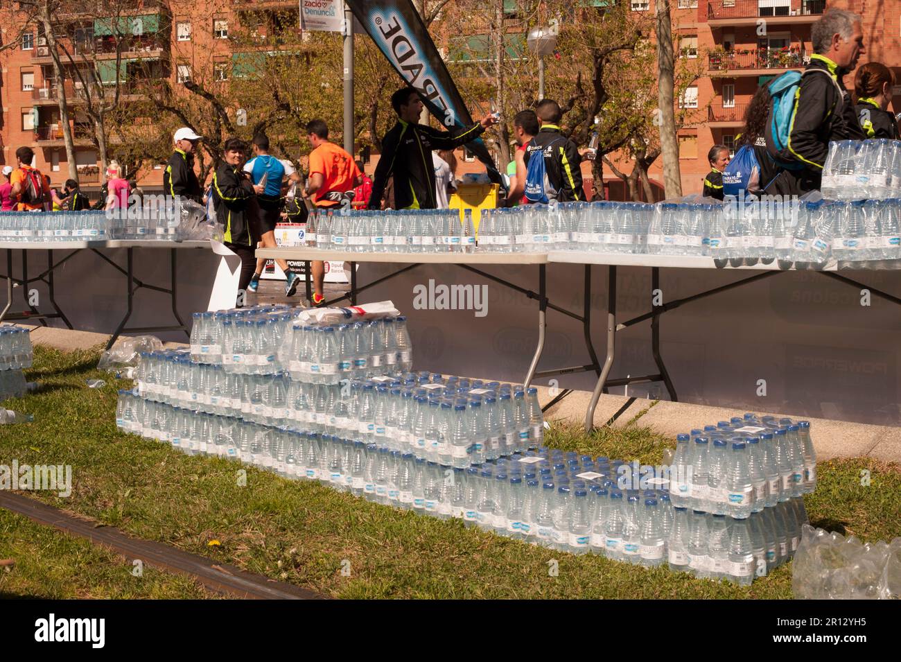 Plastic water bottles pile up for people running the Barcelona Marathon ...