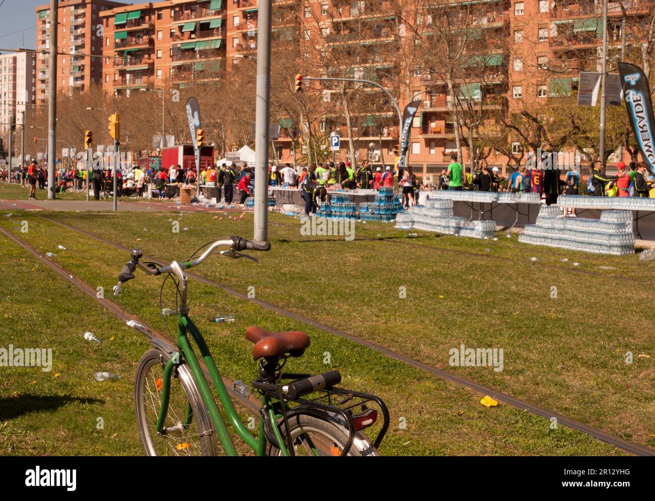 A green step through bicycle beside discarded plastic bottles in the ...