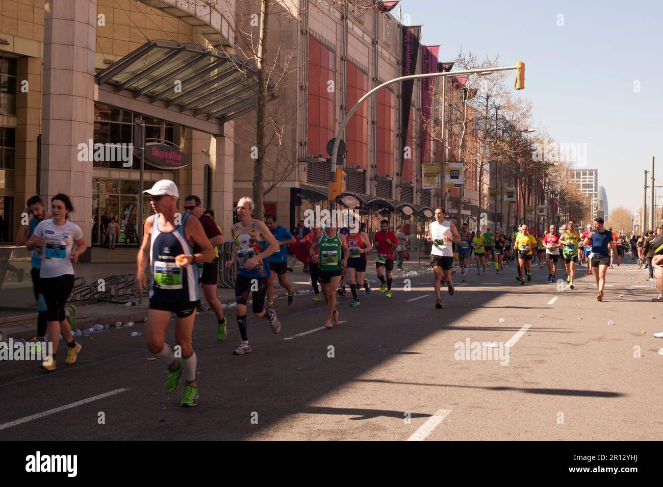 People running the Barcelona Marathon on the urban streets on a hot ...