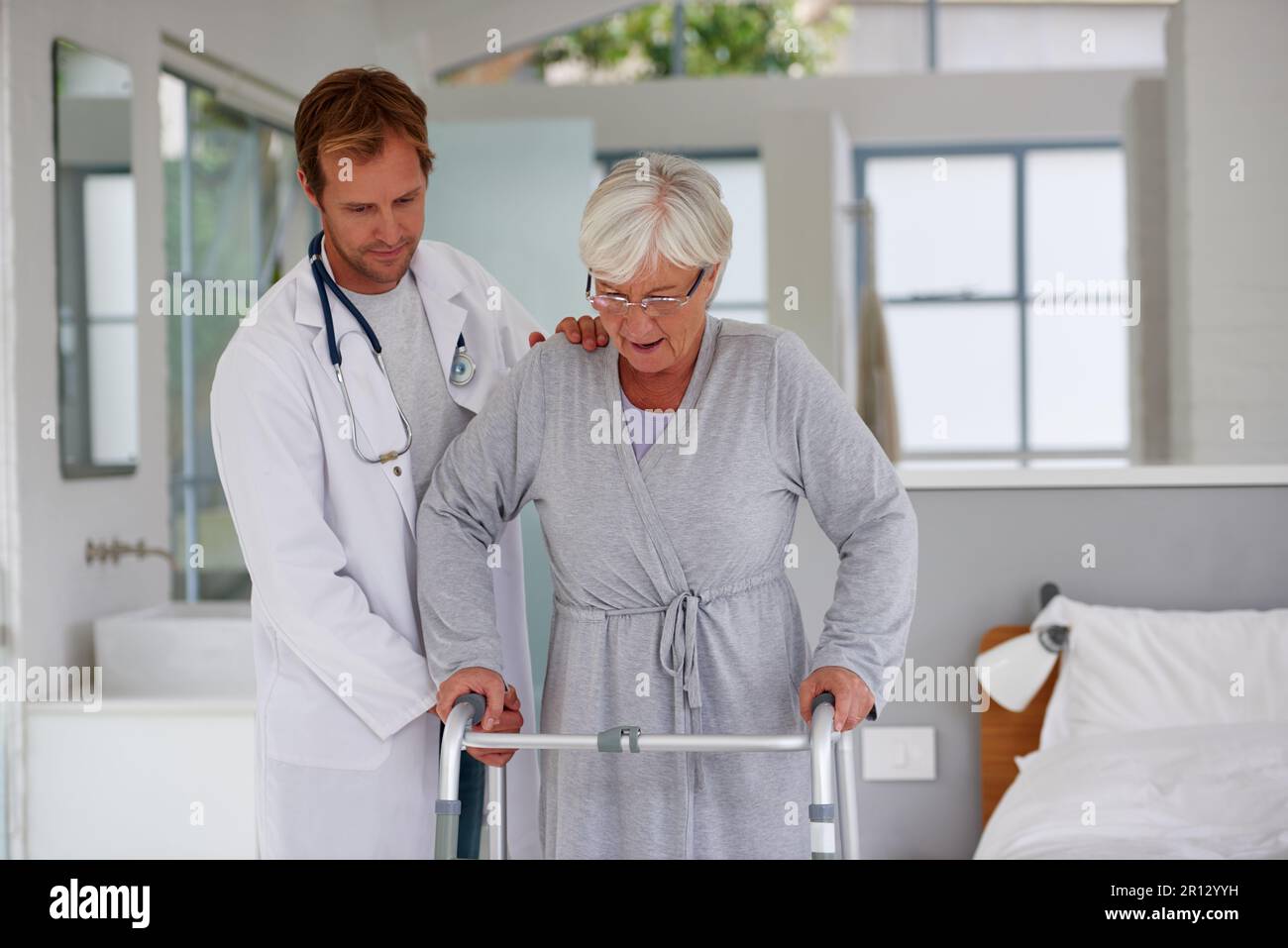 Patient recovery comes first. a senior woman walking carefully with ...