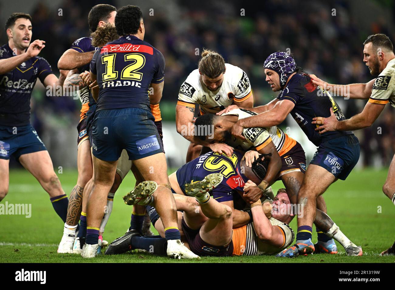 Aaron Pene of the Storm scuffles with Thomas Flegler of the Broncos ...