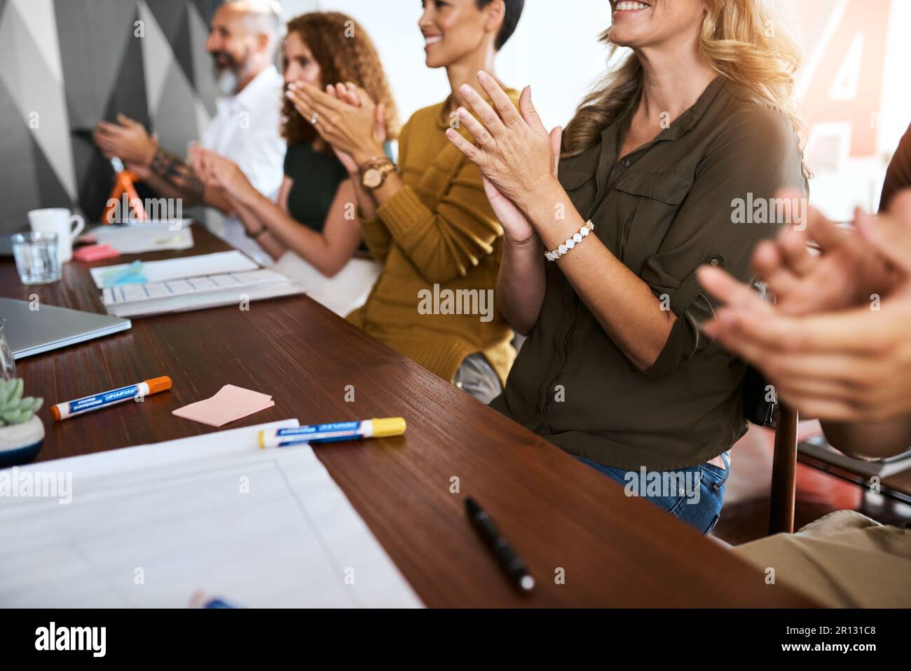 Acknowledgement of a job well done. an unrecognizable group of ...