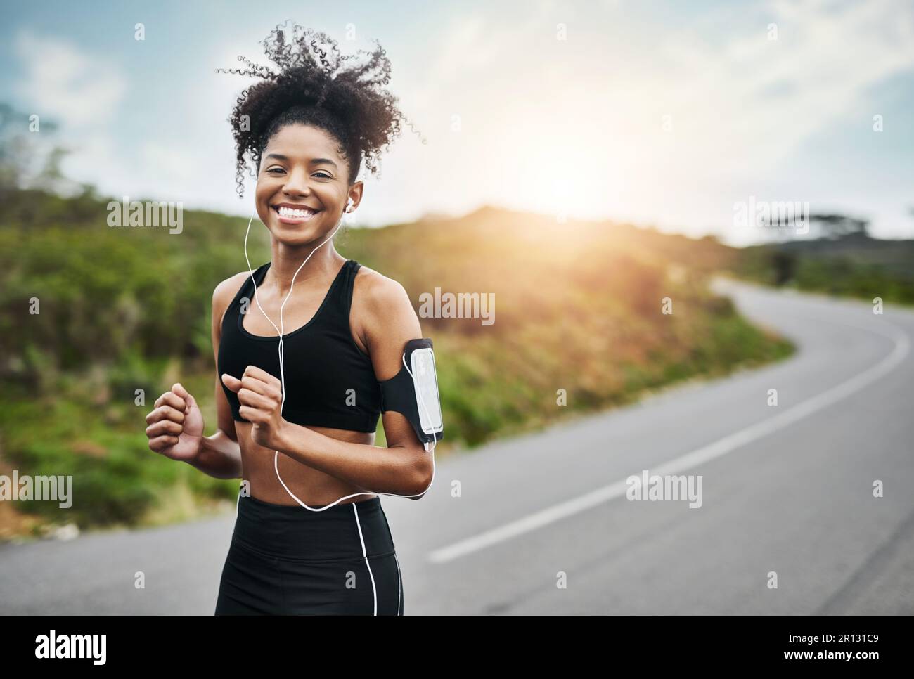Exercise, portrait and happy woman runner on a road with music for ...