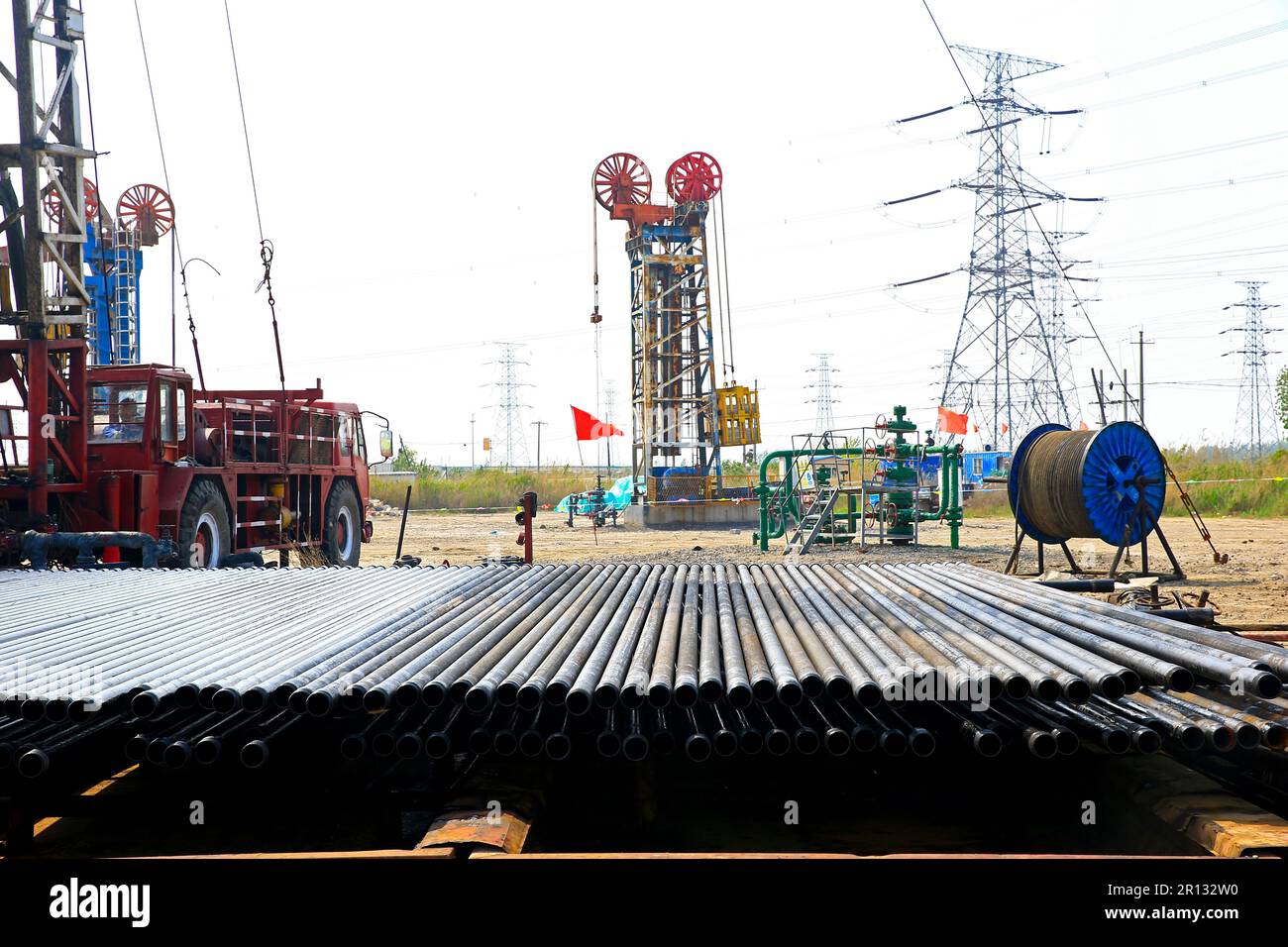 Oil field, the oil workers are working Stock Photo - Alamy