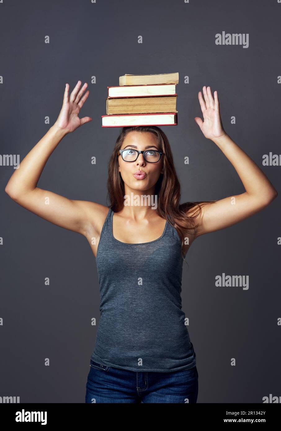 Woman balancing books head hi-res stock photography and images - Alamy