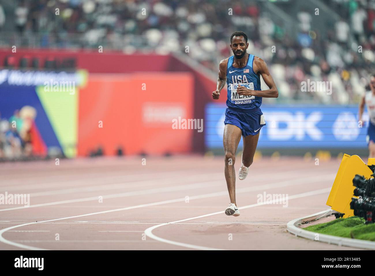 Hassan Mead participating in the 5000 meters at the 2019 World ...