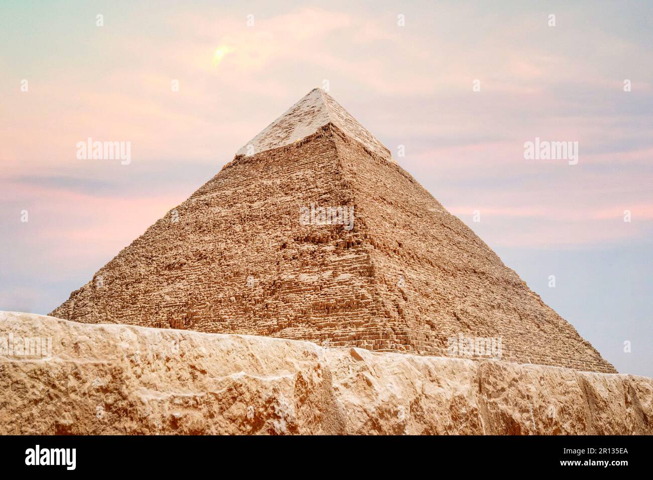 Great pyramids of ancient Egypt in Giza, Cairo. stone wall in front of ...