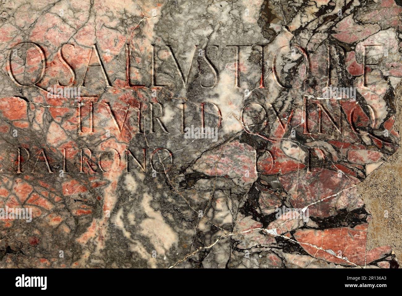 Latin inscription on stonework in the Pompeii ruins, Italy Stock Photo ...