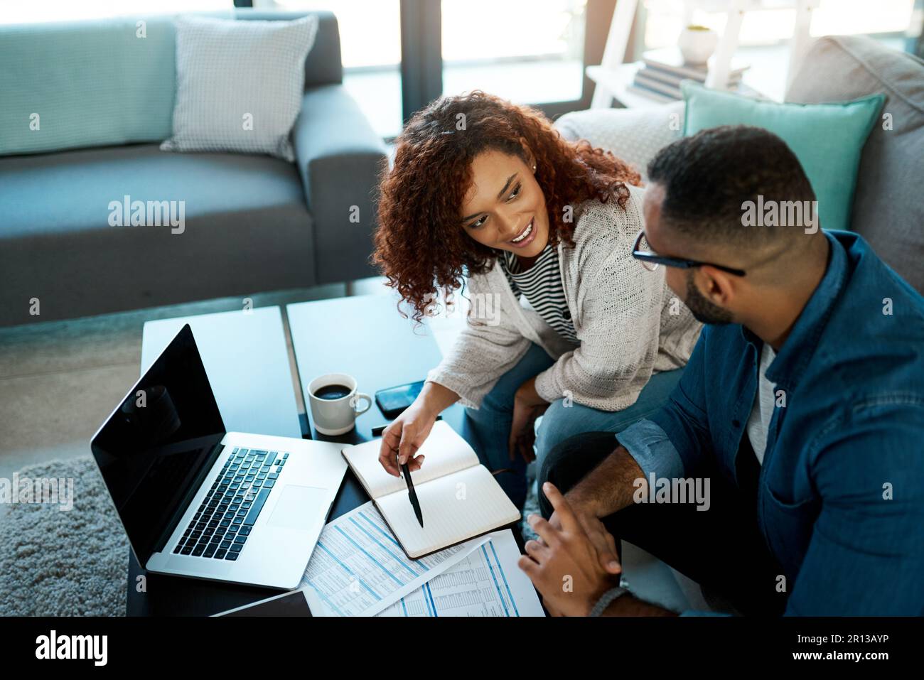 We make better budgeting choices together. a young couple planning ...