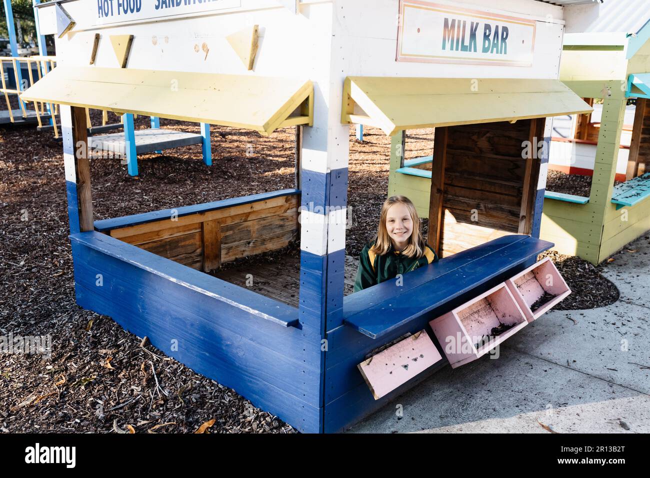 An Australian primary school girl playing in a pretend shop in the ...