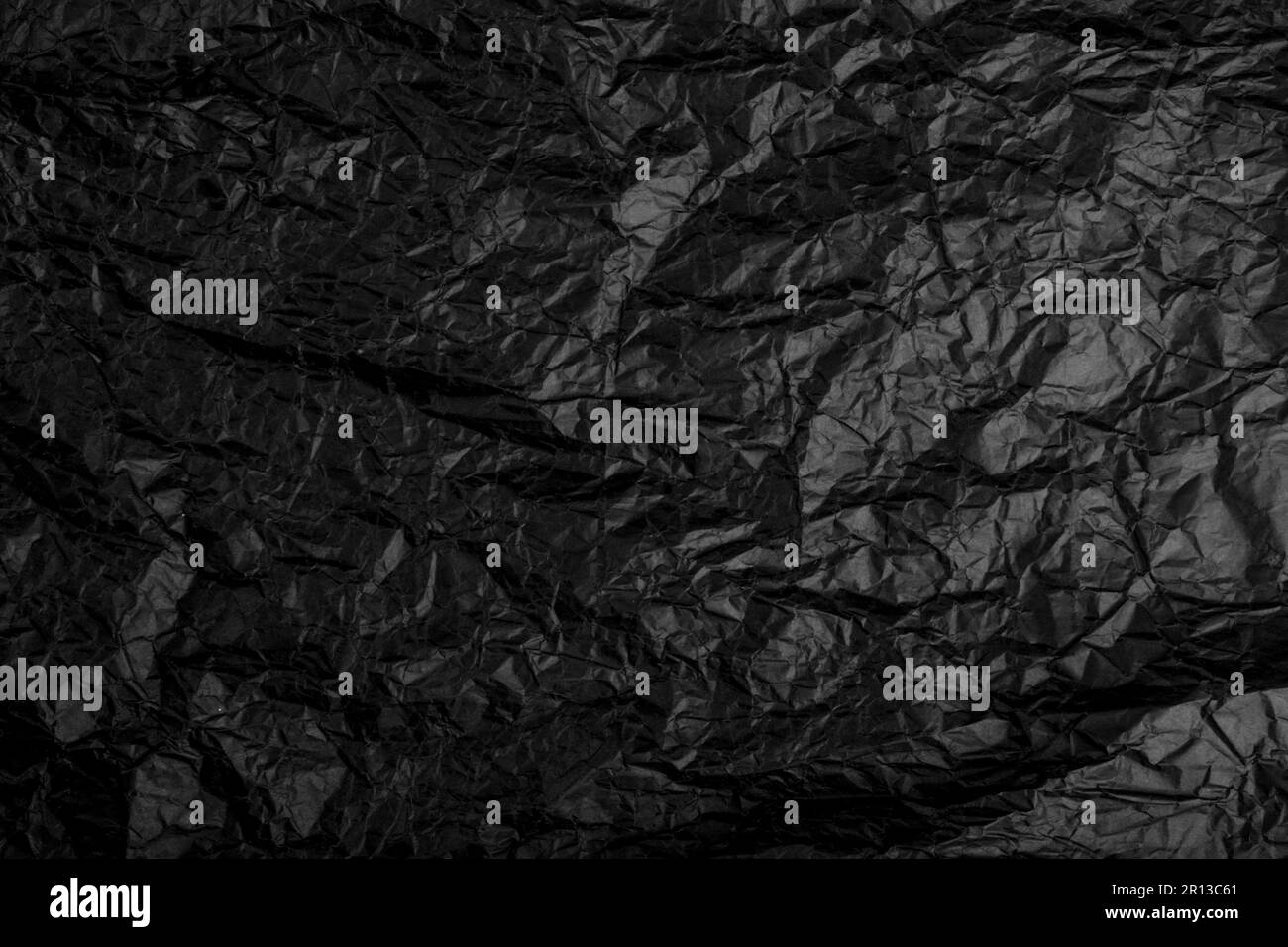 Black crumpled paper texture. wavy textured background Stock Photo - Alamy