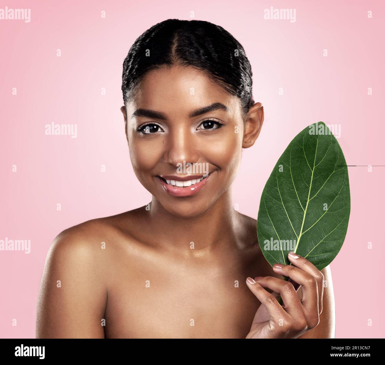 Portrait, face and happy woman with leaf for skincare in studio, pink ...