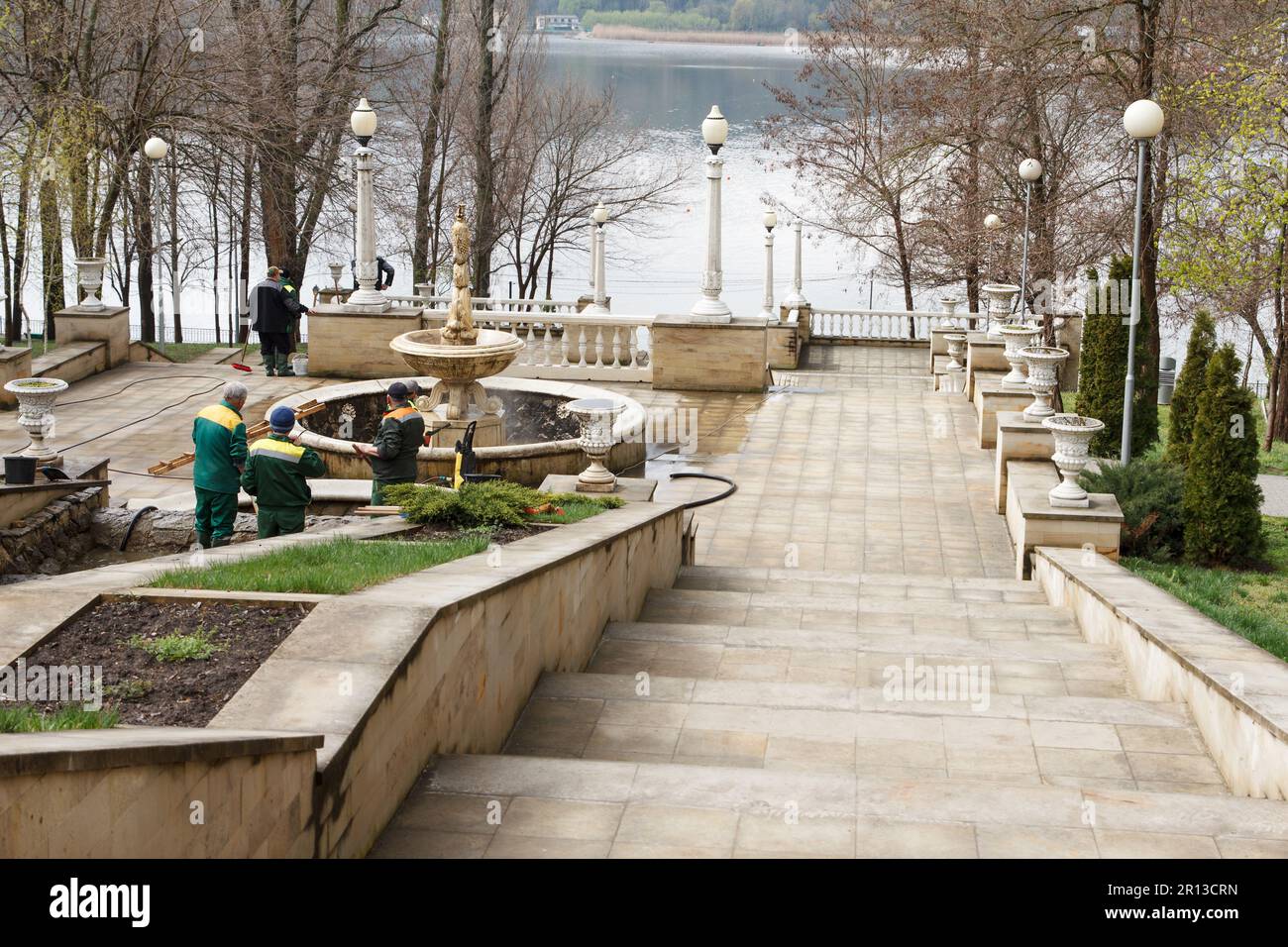 Communal professional workers carry out spring cleaning of fountains ...