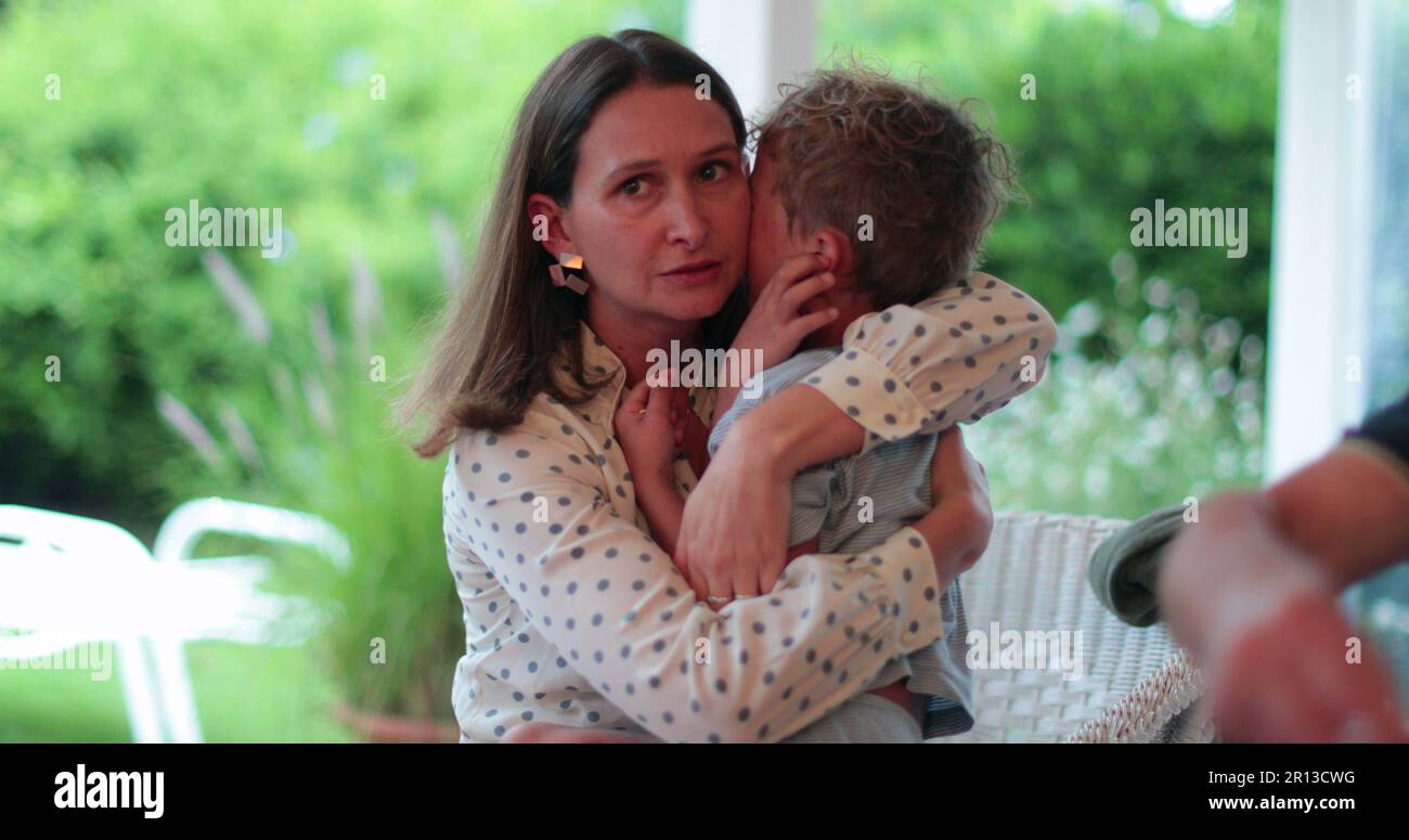 Mother consoling child boy. Candid authentic parent soothing and ...