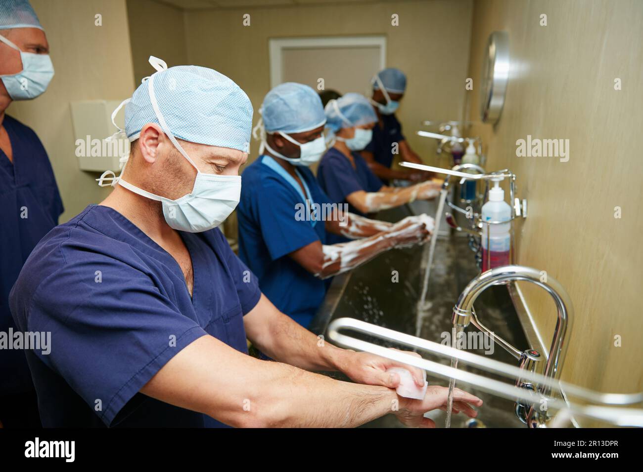 Maintaining an impeccable standard of hygiene. a team of surgeons ...
