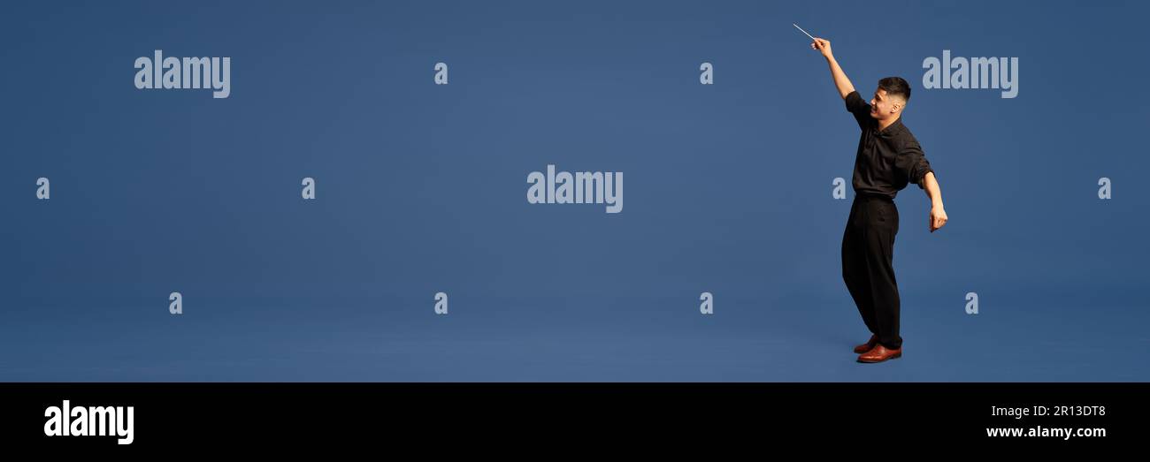 Banner with man, musician wearing costume holding conductor's baton on ...