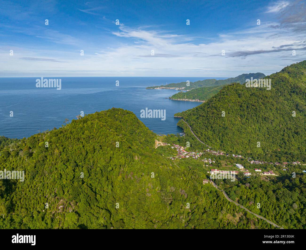 Aerial drone of coast of Sumatra with towns and mountains with jungle ...