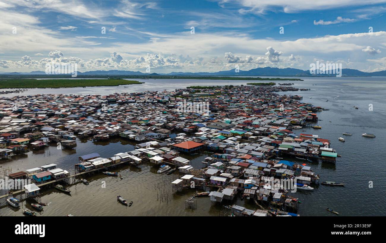 Aerial view of fishing village located on the water in the sea. Houses ...