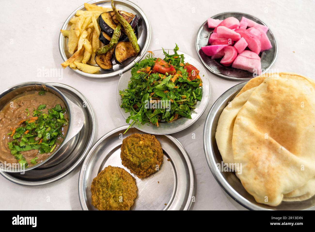 A table prepared with typical Egyptian street food of Fuul and Falafel ...