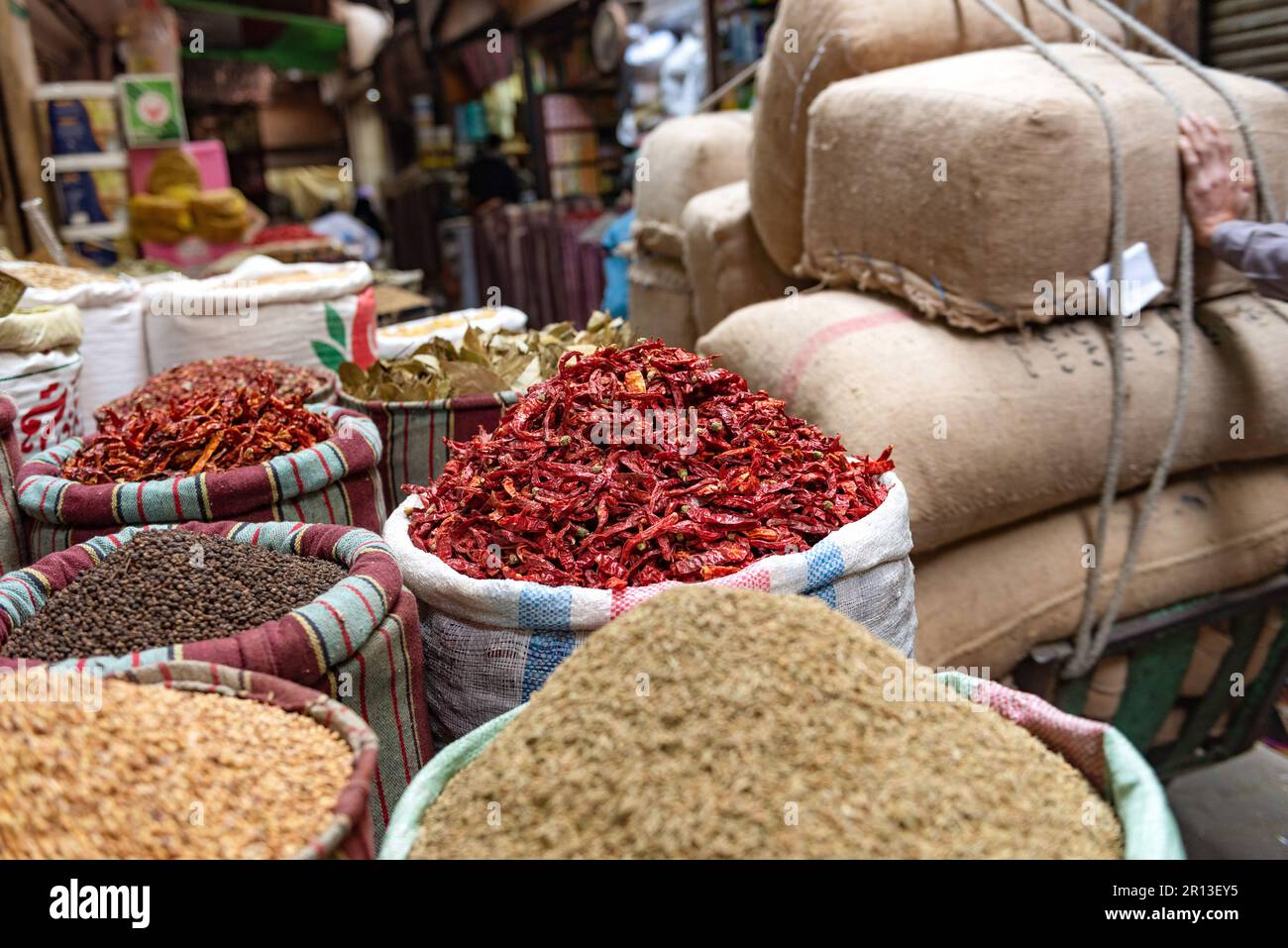 A sack of dried red chilli peppers being sold in the spice market close ...