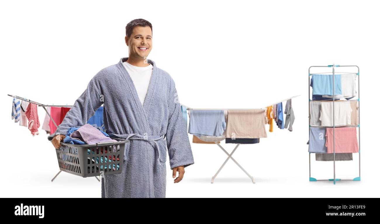 Man in a bathrobe holding a laundry basket and standing in front of ...