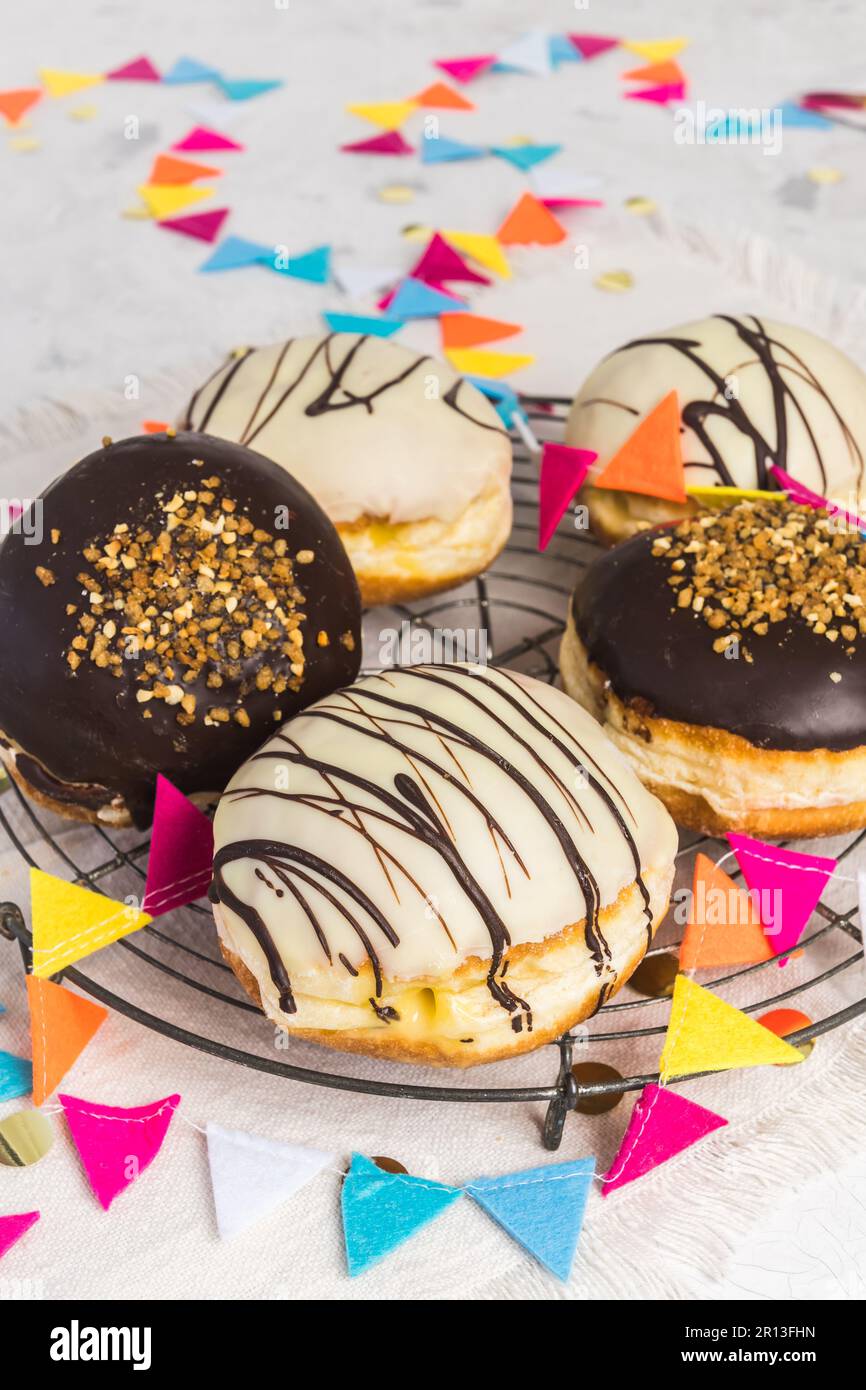 Traditional german Berliner pastries glazed with dark and white ...