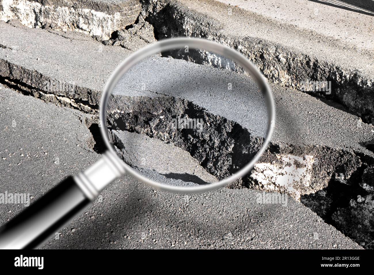 Cracked asphalt road damaged after a structural failure - Concept image ...