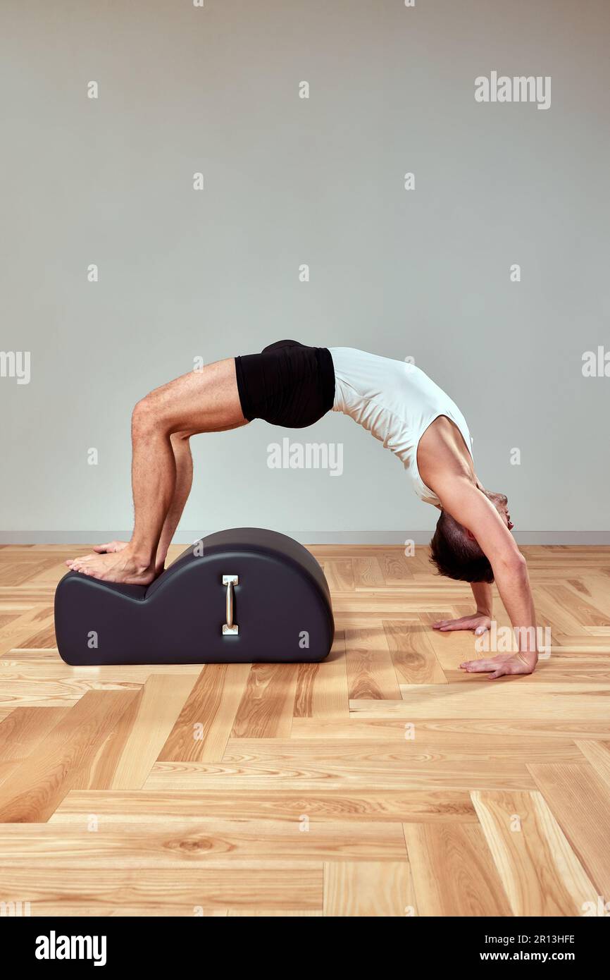 Man doing exercises on pilates reformer, pilates gymnastics reformer ...