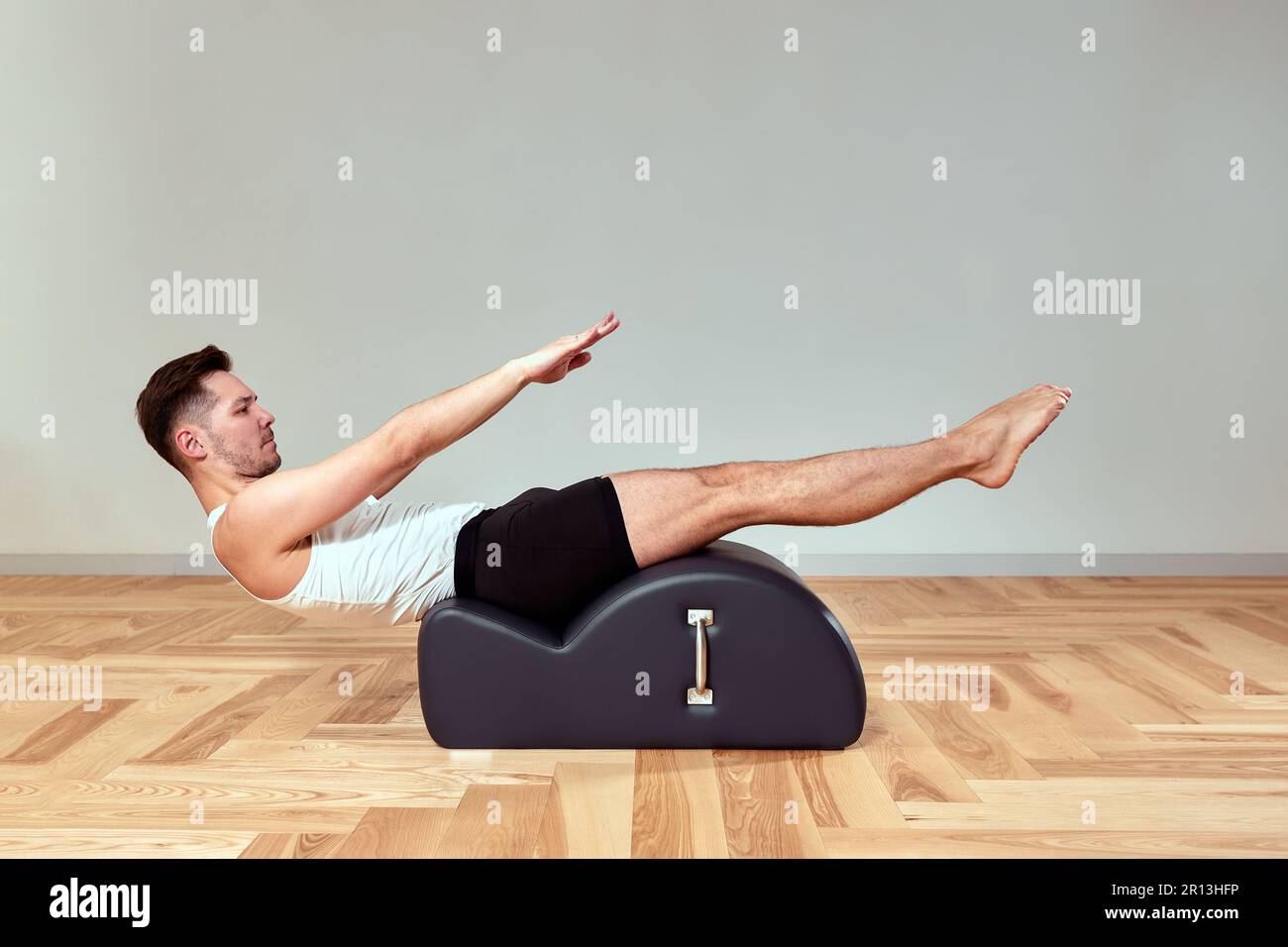 Man doing exercises on pilates reformer, pilates gymnastics reformer ...