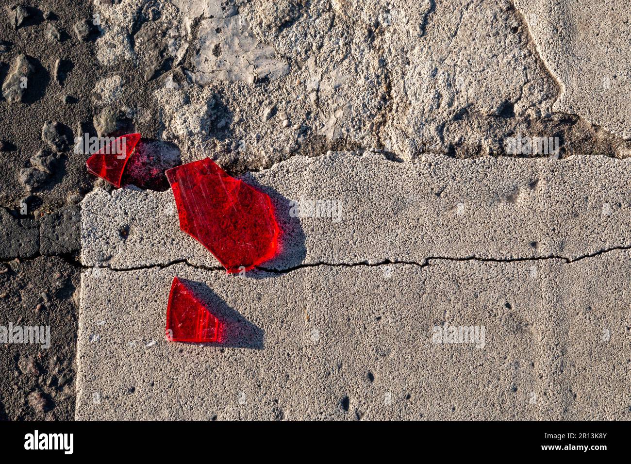 Broken red brake light glass lies on a road Stock Photo - Alamy