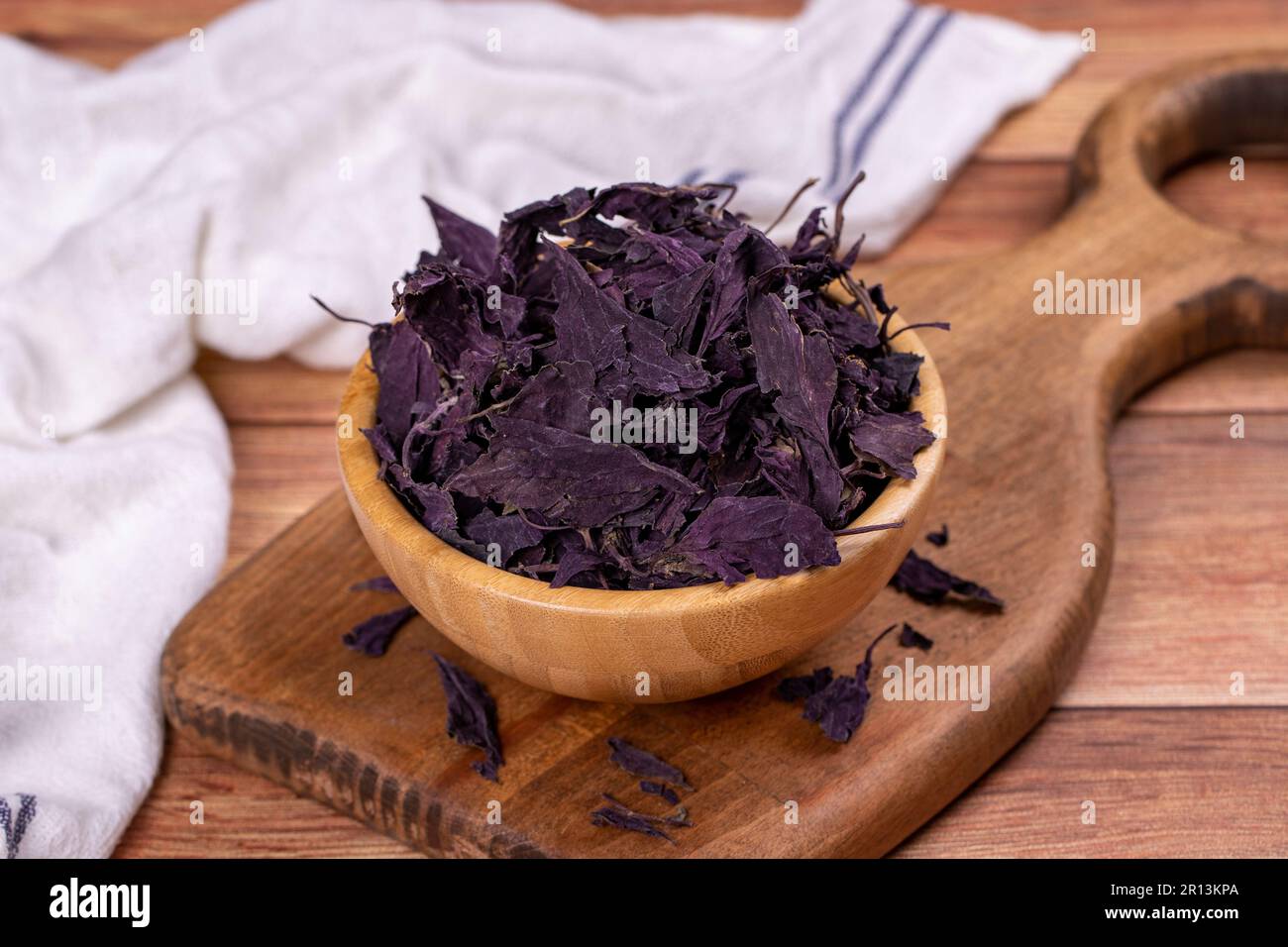 Red basil. Spices concept. Dried red basil spice on wood background ...