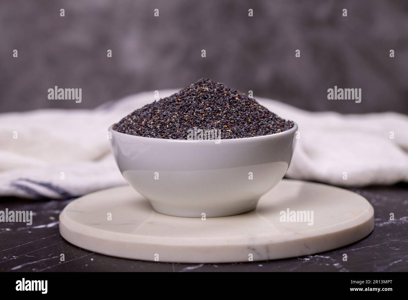 Blue poppy seeds. Spices concept. Blue poppy seeds on dark background ...