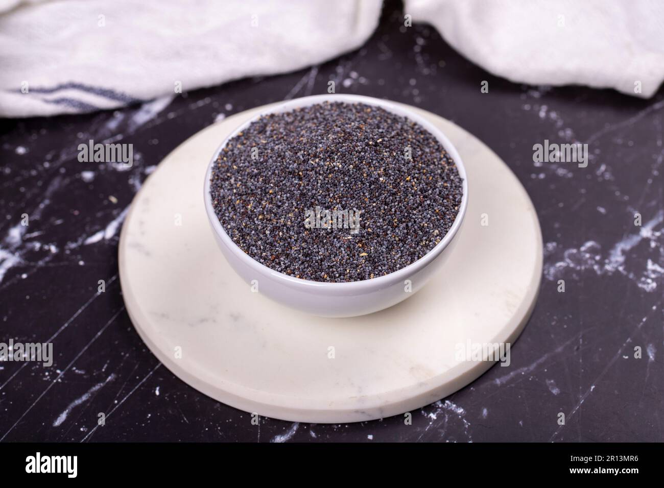 Blue poppy seeds. Spices concept. Blue poppy seeds on dark background ...