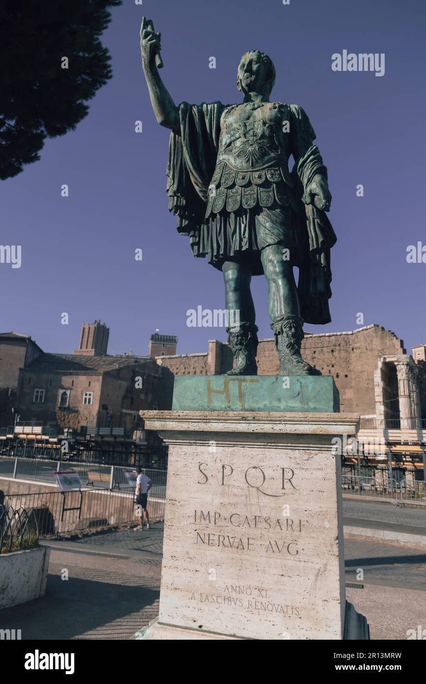 A statue of a roman soldier stands in front of a castle. Inscription on ...